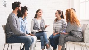 What are the essential criteria for IELTS speaking band descriptors?